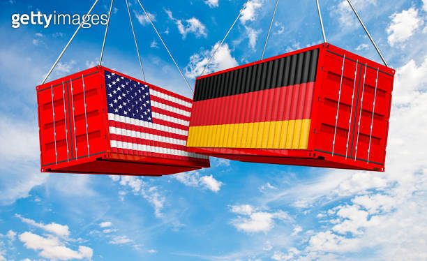 USA and Germany trade war. US of America and German flags crashed ...