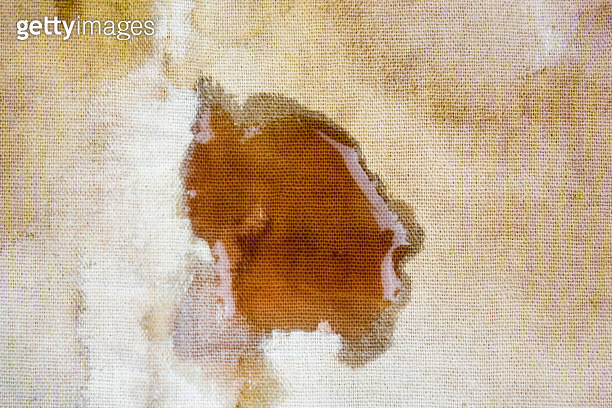 Drop of liquid on a dirty cloth close up. Spilled liquid, spilled food ...