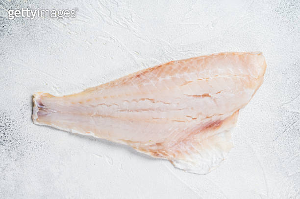 Raw red perch fillet, redfish fish meat. White background. Top view ...