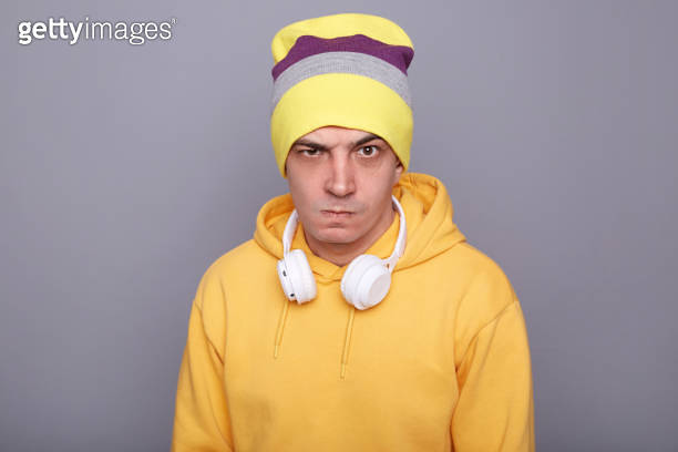 Image of angry aggressive Caucasian hipster man wearing beanie hat and ...