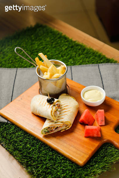 Naga Beef egg wrap roll filled with tomato, onion, cucumber with french ...