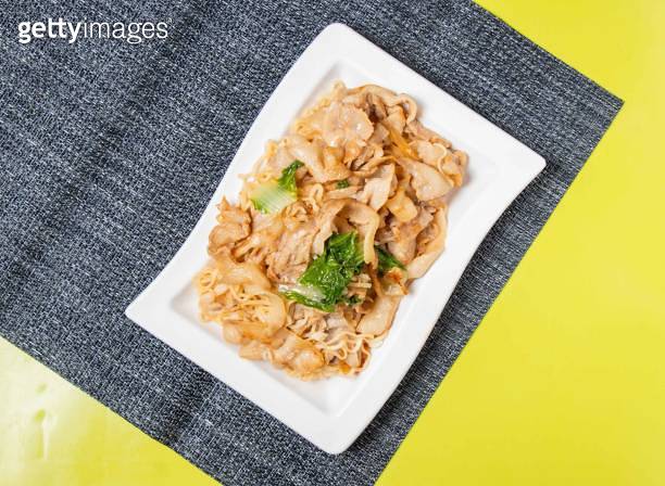 Stir-Fried Instant Noodles with Exotic Spinach and Beef served in bowl ...