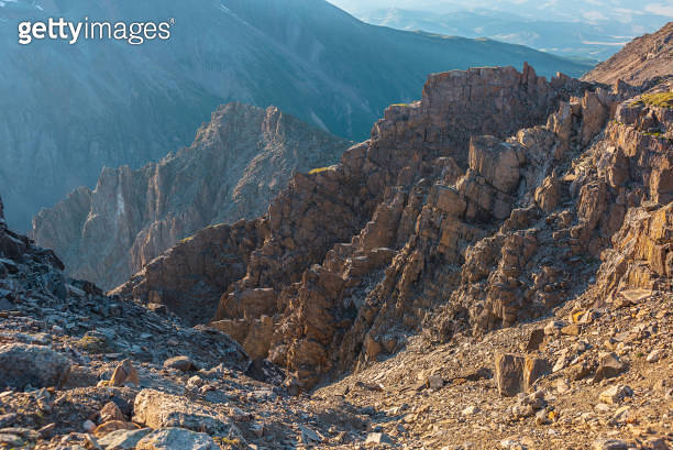 Vastness sunny mountain view from cliff at very high altitude. Scenic ...