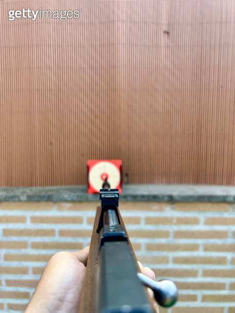View of a practice rifle aiming at a practice point, Close up of a ...