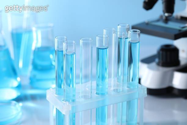 Test tubes with light blue liquid in laboratory, closeup 이미지 ...