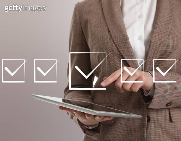 Illustration of check boxes with marks and woman using tablet on light ...