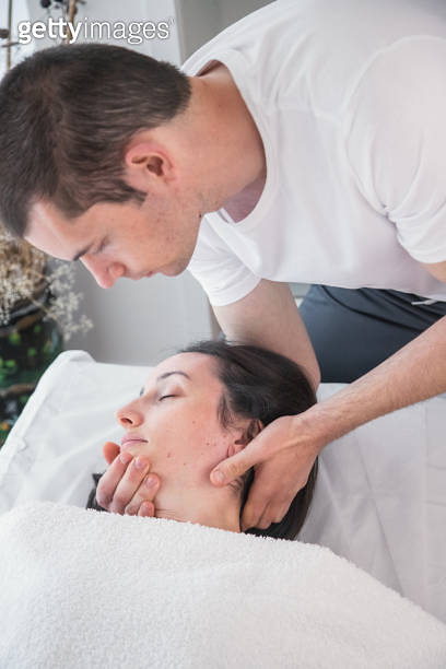 Therapist doing a session with localized massage in the region of the ...