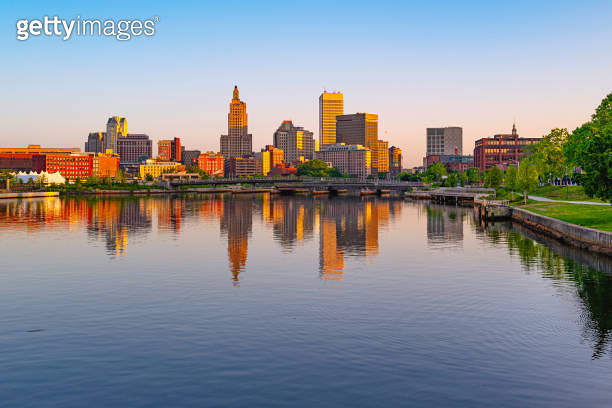 Providence downtown skyline and buildings at sunrise, tranquil water ...