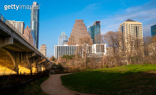 Golden light under the bridge at the riverwalk jogging trail along the ...