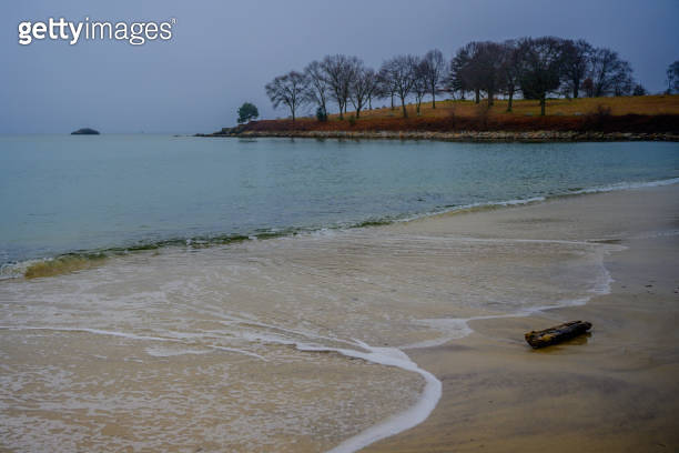 Niantic Beach Seascape with gentle waves rolling in on the sand with a ...