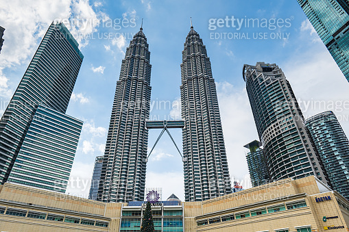 Petronas towers in Kuala Lumpur. The twin towers are one of the most ...