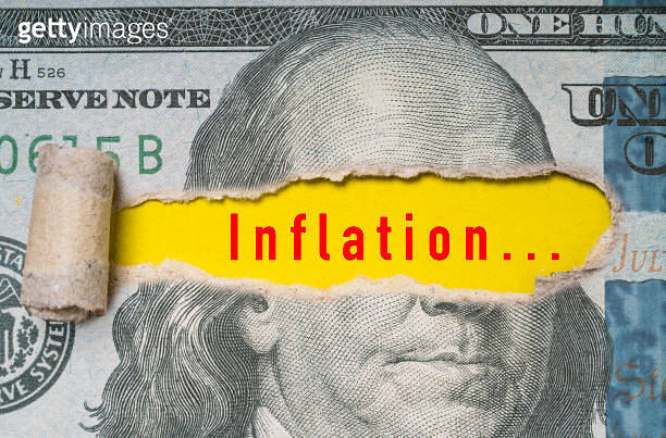 USD dollar banknote was torn at Benjamin Franklin 's eye with inflation ...