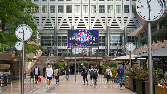 Six Public Clocks square in Canary Wharf district in London, United ...