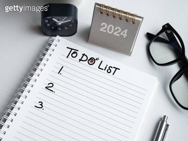 New year to do list. Handwriting text and list numbers on blank notepad ...