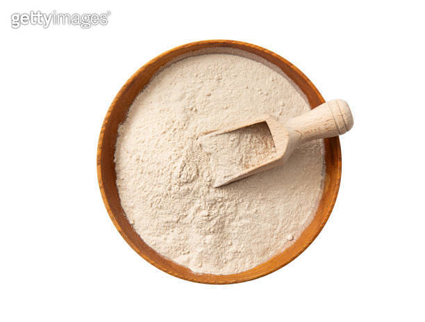 Psyllium husk flour powder on wood bowl and spoon isolated on white ...