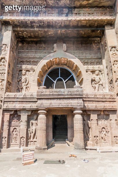 Ornate entrance of the Buddhist chaitya prayer hall , cave 19, carved ...