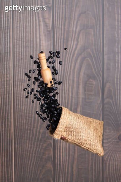 Black Bean flying explosion in sack bag, black grain beans explode ...