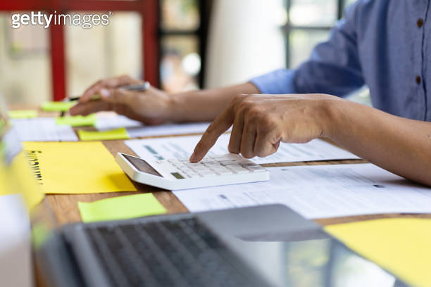 Meeting of colleagues is discussing financial statement analysis in ...