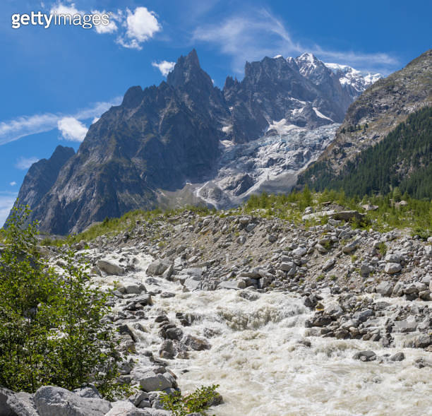 The Mont Blanc Massif with the glacial stream of Brenva glacier over ...