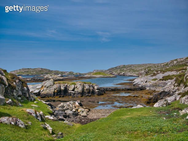 A rocky bay on the coast the island of Bernera (Great Bernera) in Loch ...