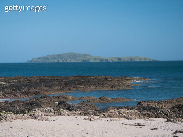 The island of Sanda or Sandaigh from the rocky coastline at the ...
