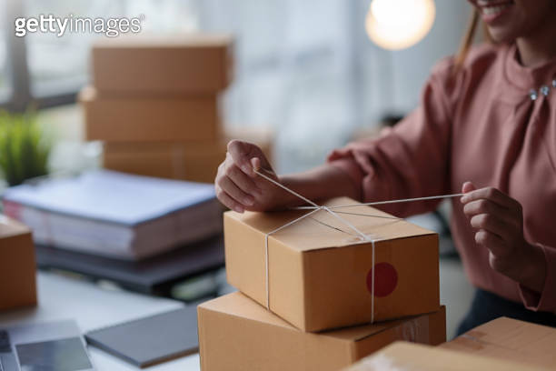 Close-up of an online business owner woman check customer lists to ...