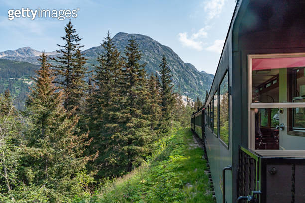 White Pass Summit excursion tour train in the mountains, Alaska, USA ...