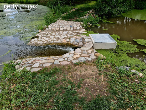 pond sluice, water reservoirs with regulation and concrete dam shaft ...
