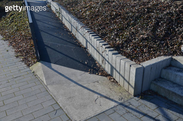 gray monolithic concrete park bench made of concrete in the shape of ...
