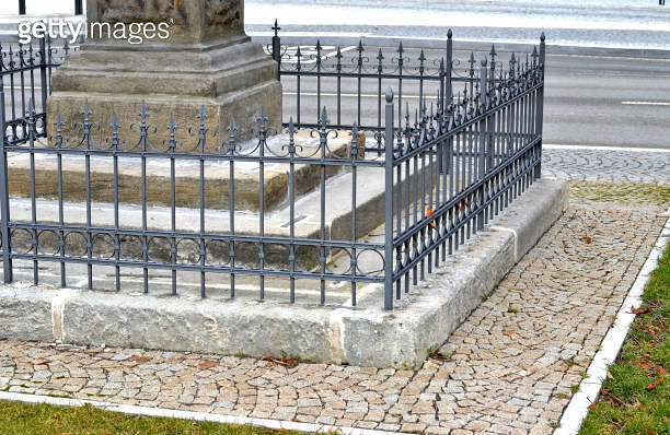 fencing with ornamental trellises and flowers forged by a blacksmith ...