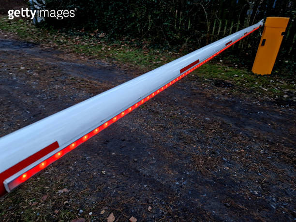 traffic barrier to yard with LED light strip. Striped aluminum barriers ...