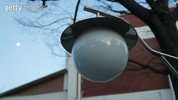 Sphere lamps on the evening city street 이미지 (1734180765) - 게티이미지뱅크