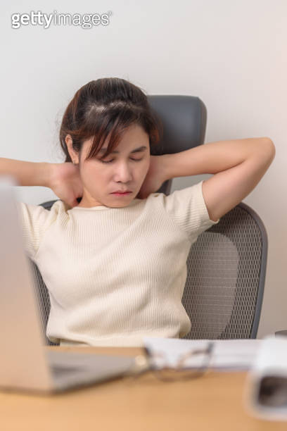 Woman having Neck and Shoulder pain during work long time on workplace ...