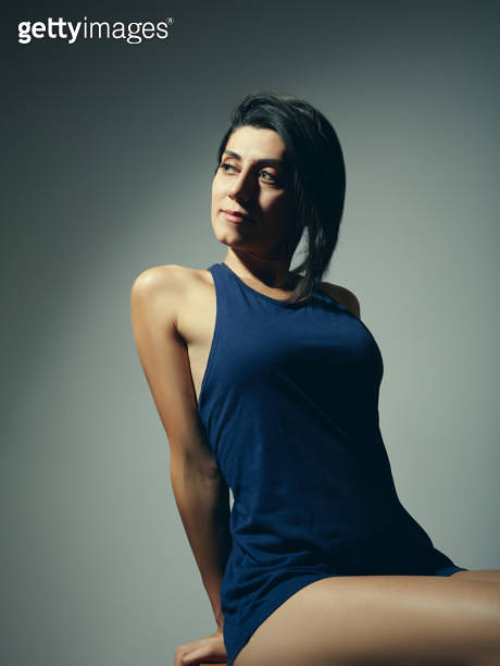 Female fashion model posing in a moody environment and looking away 이미지 ...