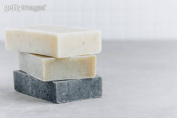 Soap. Organic soap bars. Stack of natural soap bars on gray stone ...