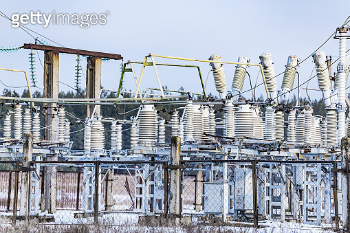 High voltage vintage electrical substation in Ukraine in winter. Wiring ...