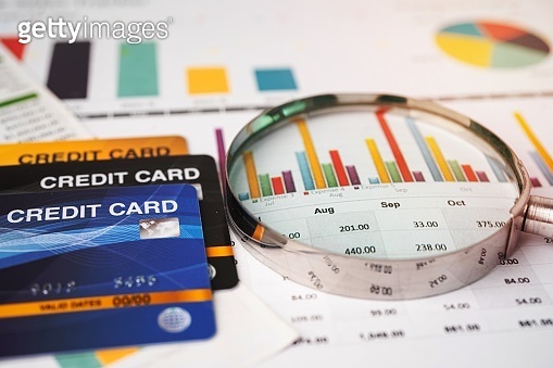 Credit card model with Magnifying glass, Financial development ...
