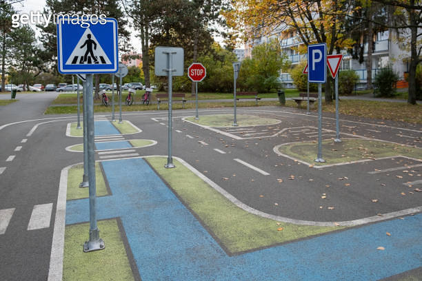 A children's playground designed as a mini road with road signs ...