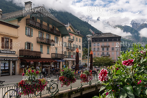 The historic centre of the alpine village with the Mont Blanc massif in ...