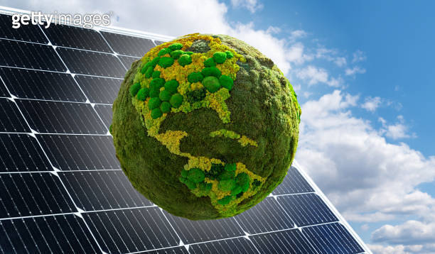 Green planet Earth from natural moss on a background of solar panels ...