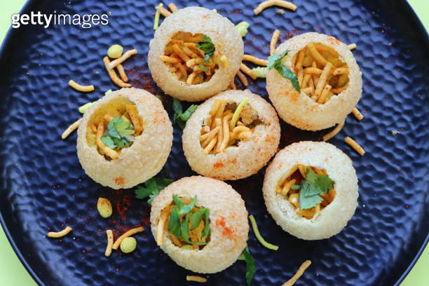 Sukha puri or Sukha masala puri, a dry version of sev puri filled with ...