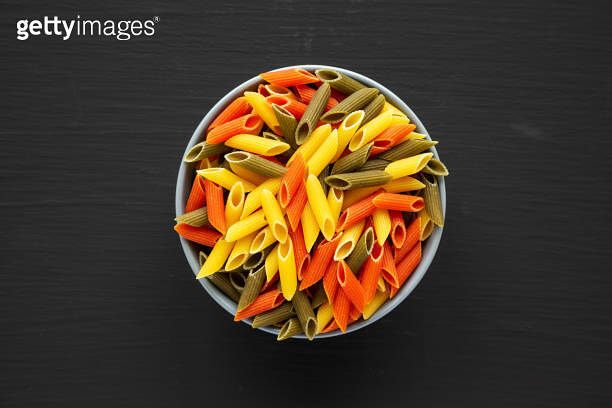 Durum Wheat Semolina Pasta with Tomato and Spinach in a Bowl, top view ...