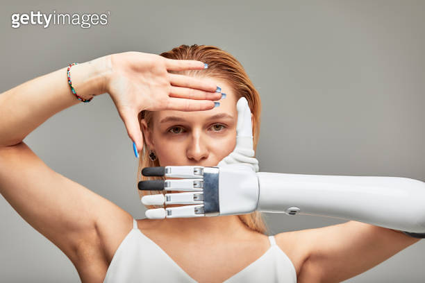 Studio portrait of a young girl with disability wearing sensory bionic ...