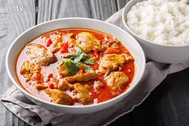 Asian chicken curry in a sauce consisting of onion, ginger, lemongrass ...