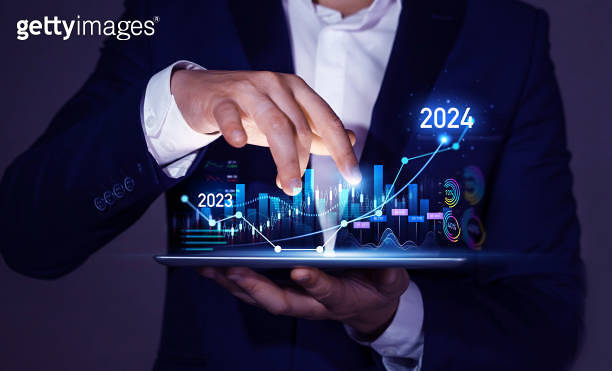 Businessman draw growth graph a year 2024 of business and data analysis ...