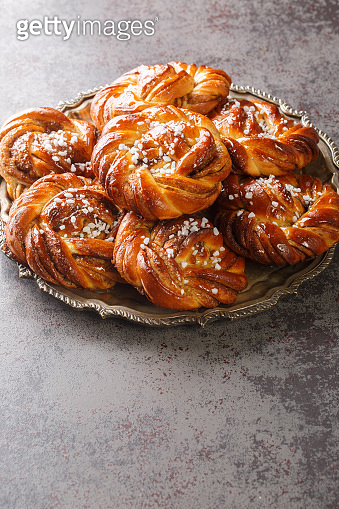 Cinnamon roll or kanelbulle is a famous Swedish pastry close-up on a ...