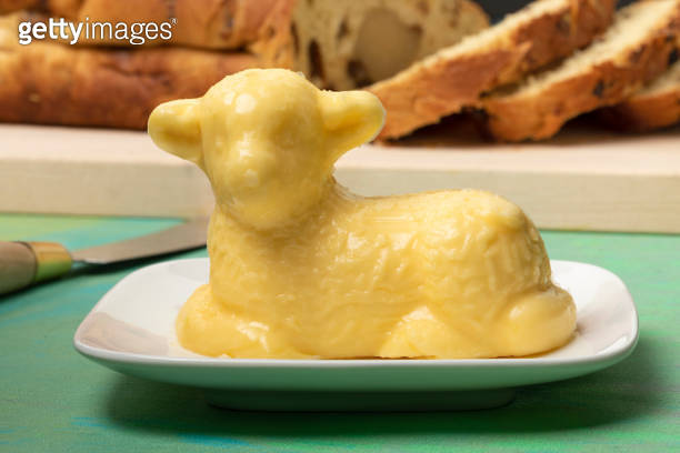 Traditional easter butter lamb in front of an easter bread close up ...