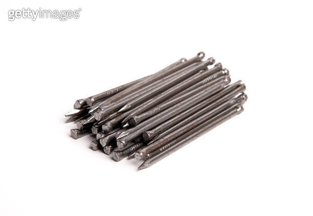 Pile Of Silver Shiny Sharp Metal Nails Isolated On White Background ...