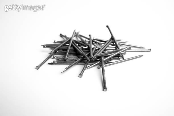 Pile Of Silver Shiny Sharp Metal Nails Scattered On White Background ...