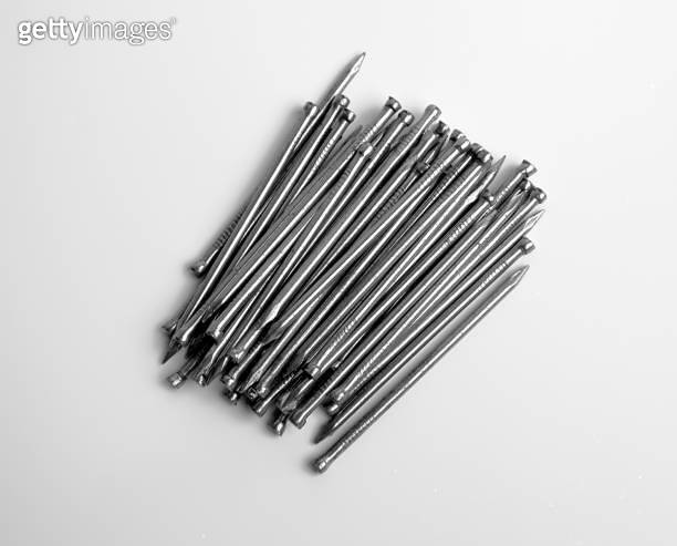 Pile Of Silver Shiny Sharp Metal Nails Isolated On White Background ...
